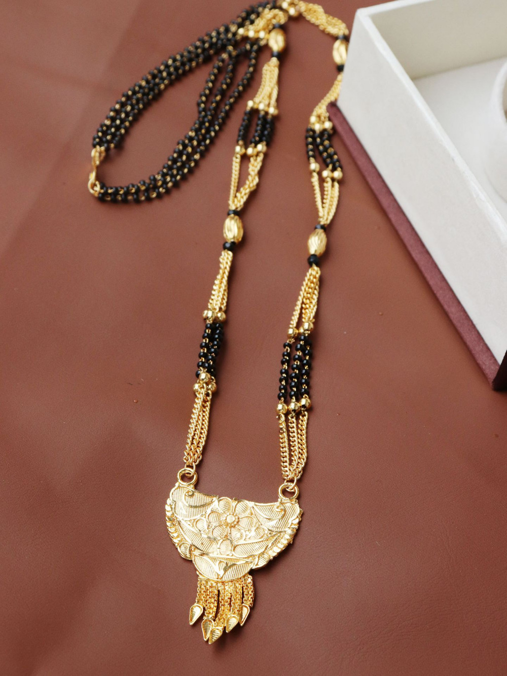 Buy Elegant Combination of Golden Mangalsutras at joolkart.com